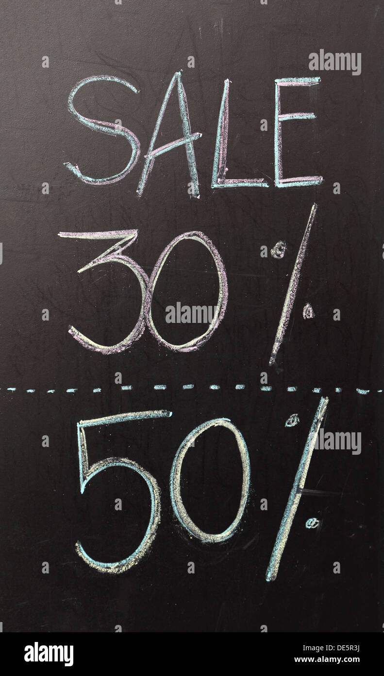 30 and 50 discount sign written with chalk on blackboard Stock Photo ...