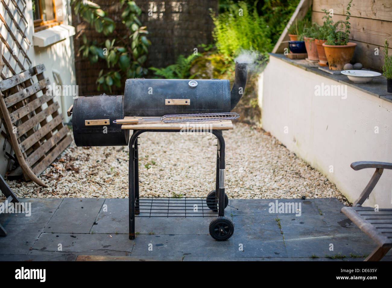 Fish traditionally cooking in a wood fired smoker, UK Stock Photo - Alamy