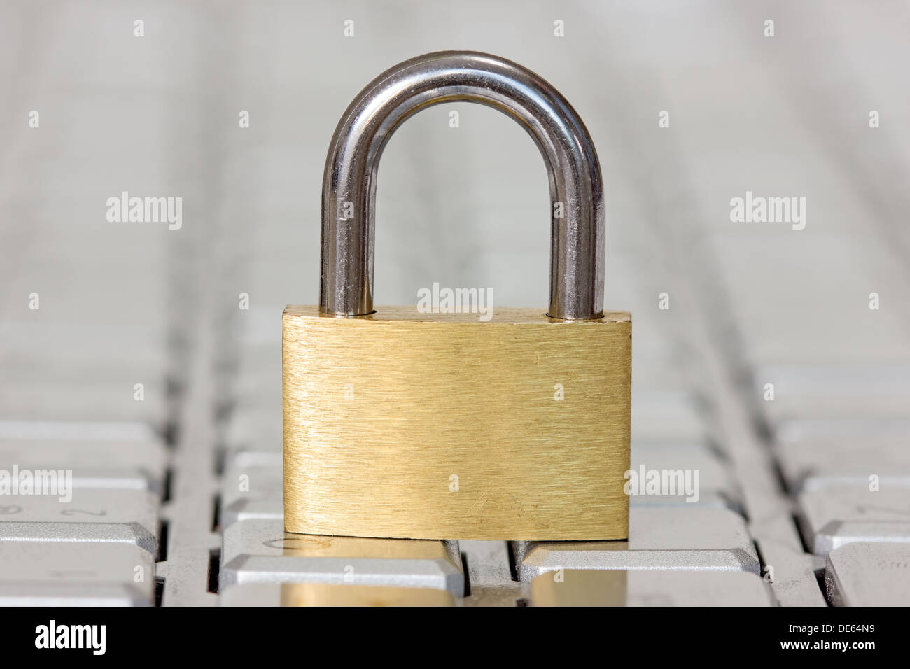 IT safety concept, golden lock on the keyboard Stock Photo - Alamy