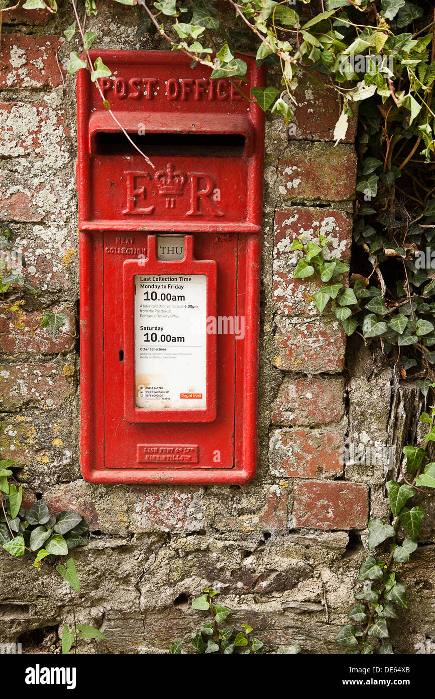 Red posting box set in an ivy covered wall Stock Photo - Alamy