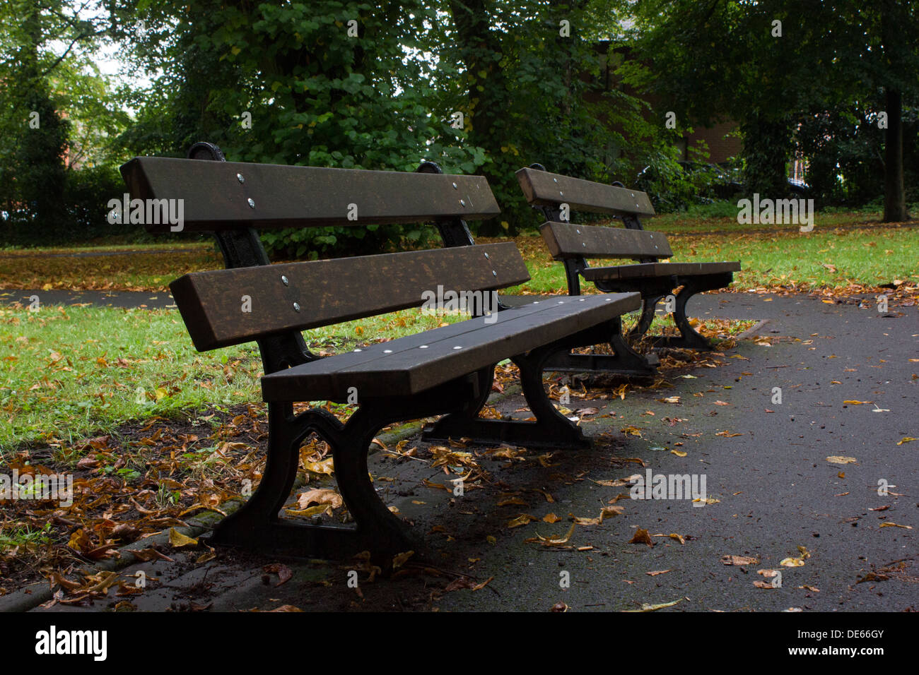 Two benches in a church yard Stock Photo - Alamy
