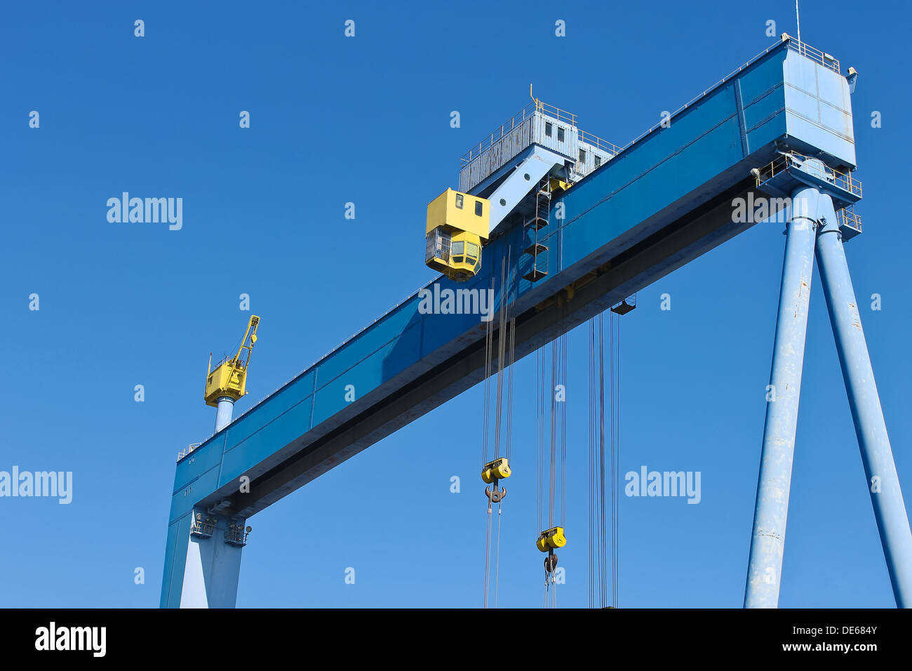Gantry crane at shipyard on the background of blue sky Stock Photo - Alamy