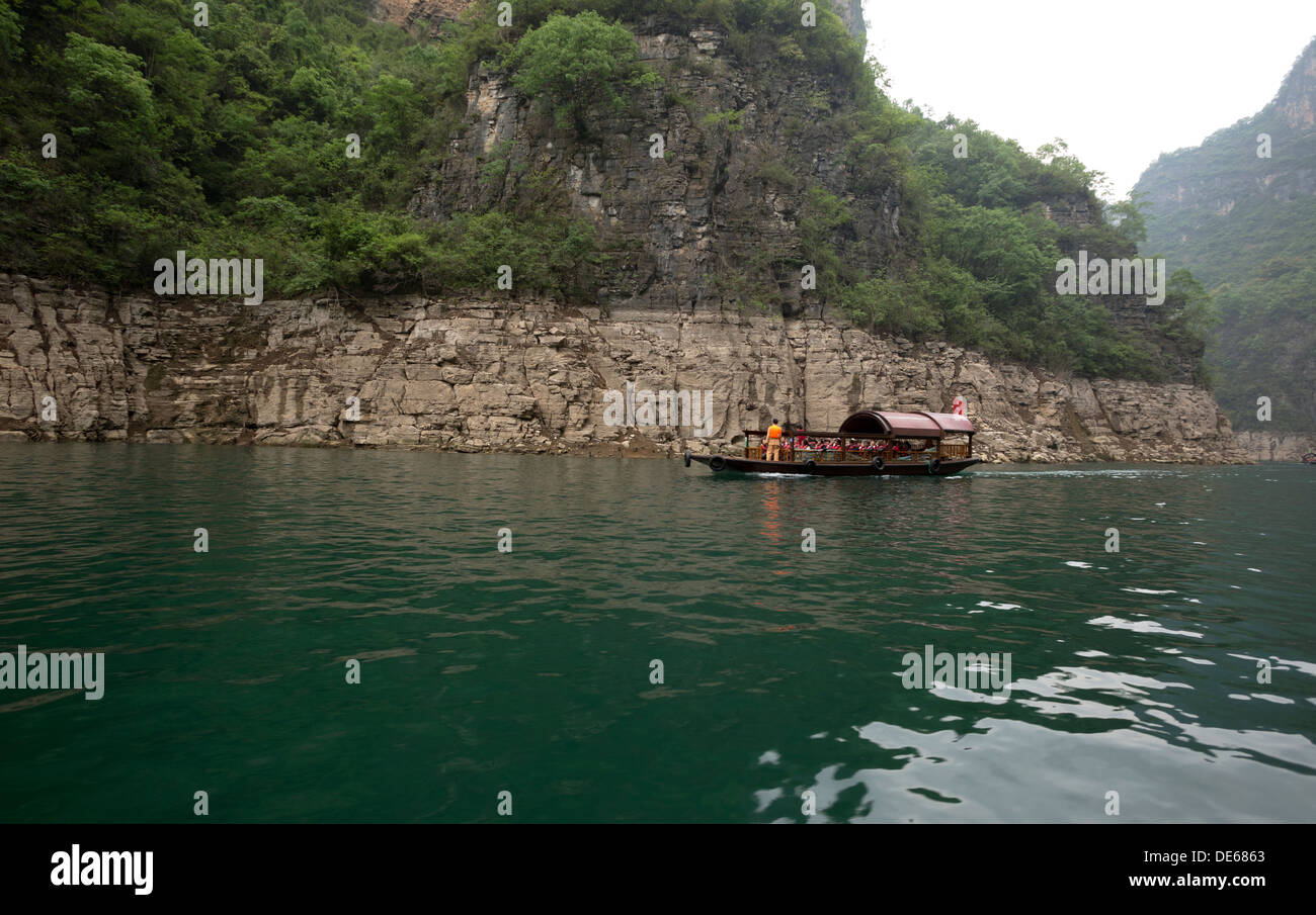 Tourist boats taking tourists up the Daning River through Three Gorges ...