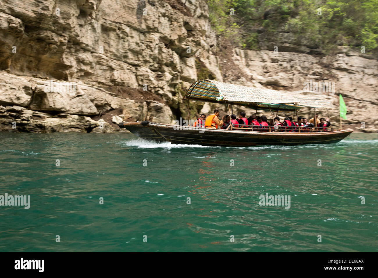Tourist boats taking tourists up the Daning River through Three Gorges ...