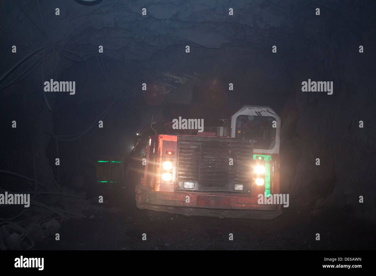 A heavy vehicle with raw gold ore in an underground mine stope Stock ...