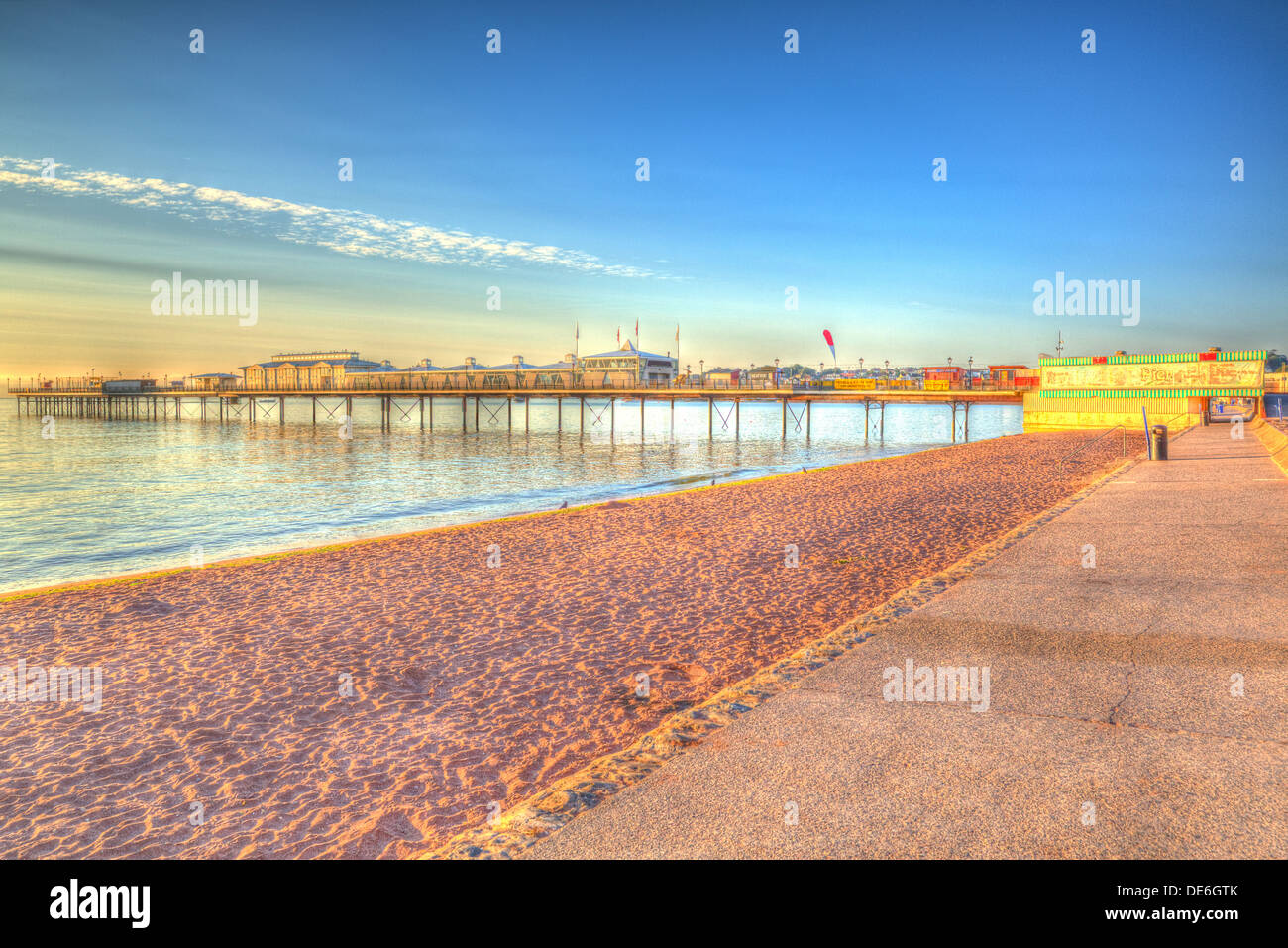 Paignton pier and sandy beach Torbay Devon England in HDR with blue sky ...