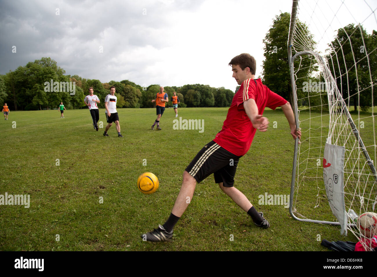 Munich, Germany, Bavarian students play football in the English Garden ...