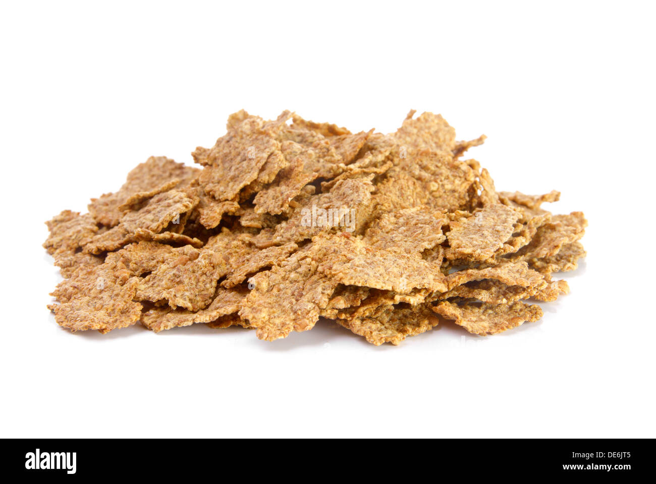 Pile of bran flakes over white background Stock Photo - Alamy
