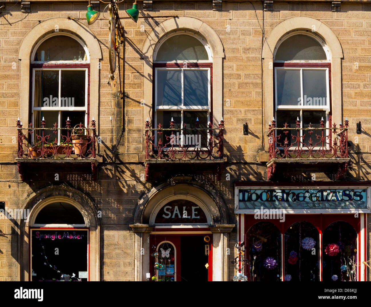 Detail of arched windows above a tourist shop selling glassware in ...