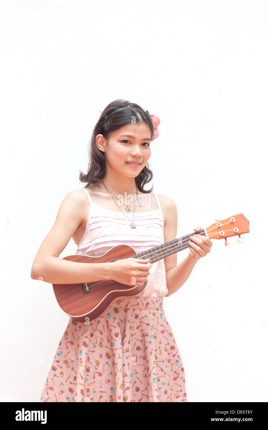 Asian girl with ukulele guitar isolated white background Stock Photo ...