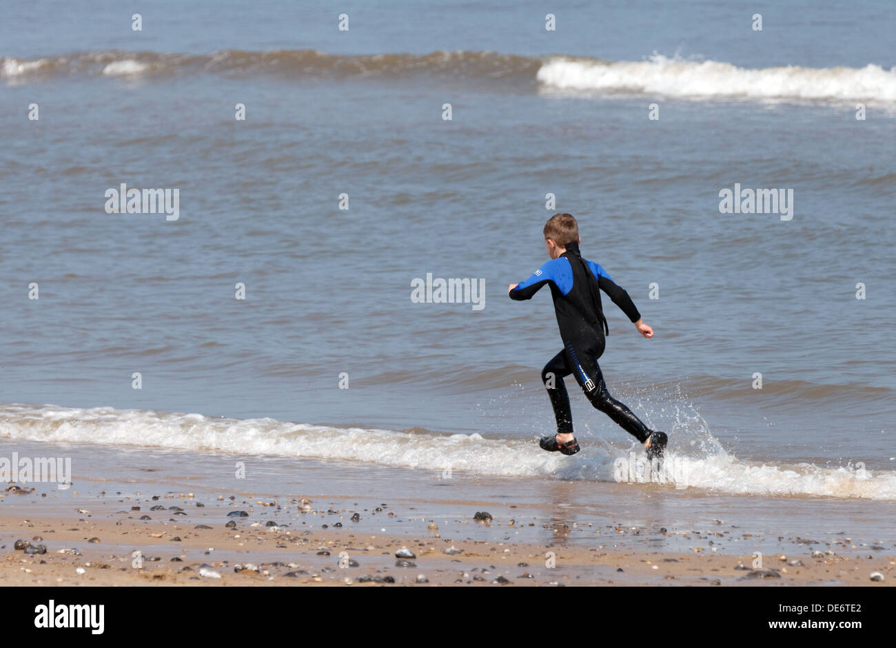 Running in the waves hi-res stock photography and images - Alamy