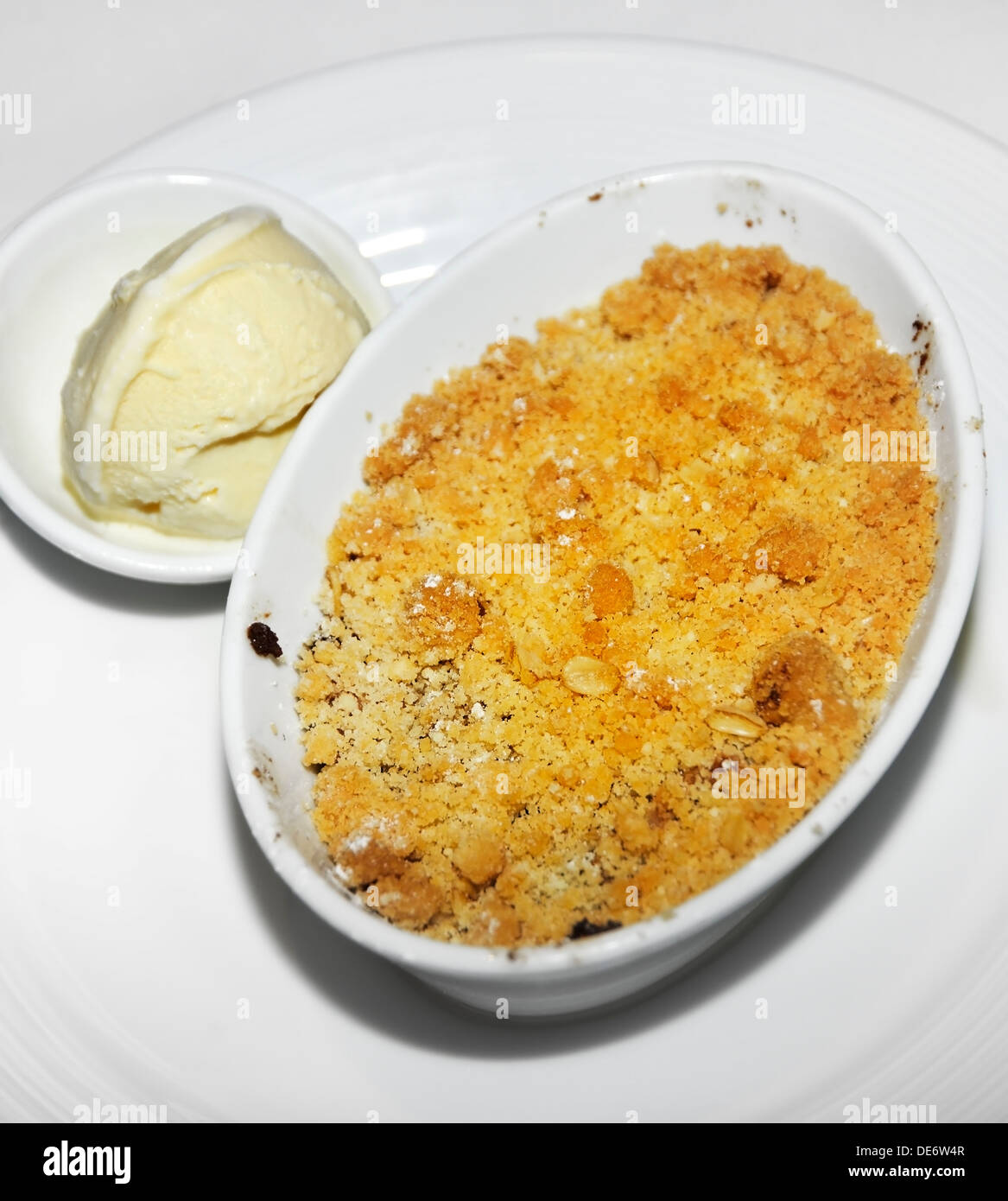 Apple Crumble Dessert With Vanilla Ice Cream Stock Photo - Alamy