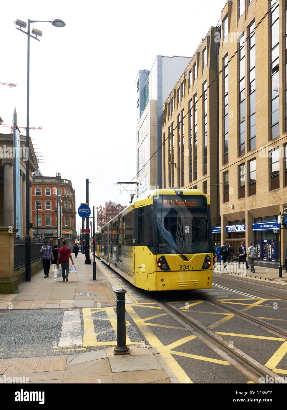Tram in Mosley Street Manchester UK Stock Photo - Alamy