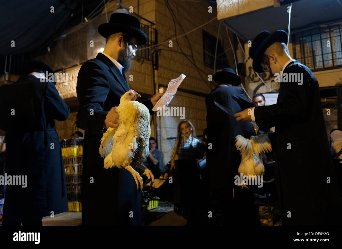 Haredi Jews performing the Kapparot ritual on Yom Kipur eve in Mea ...