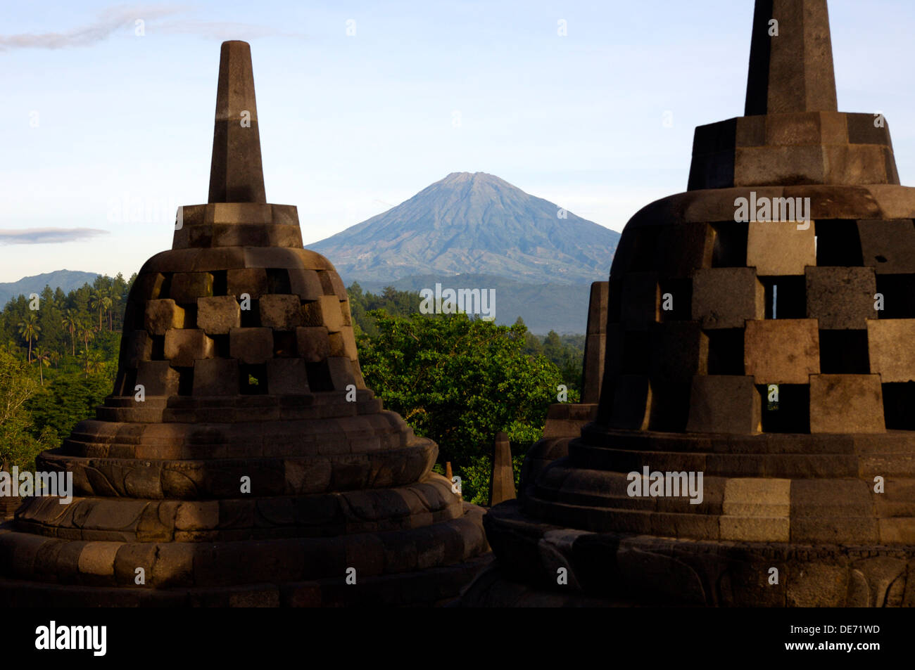 Gunung Merapi viewed through the stupa at Borobudur, Buddhist Temple ...