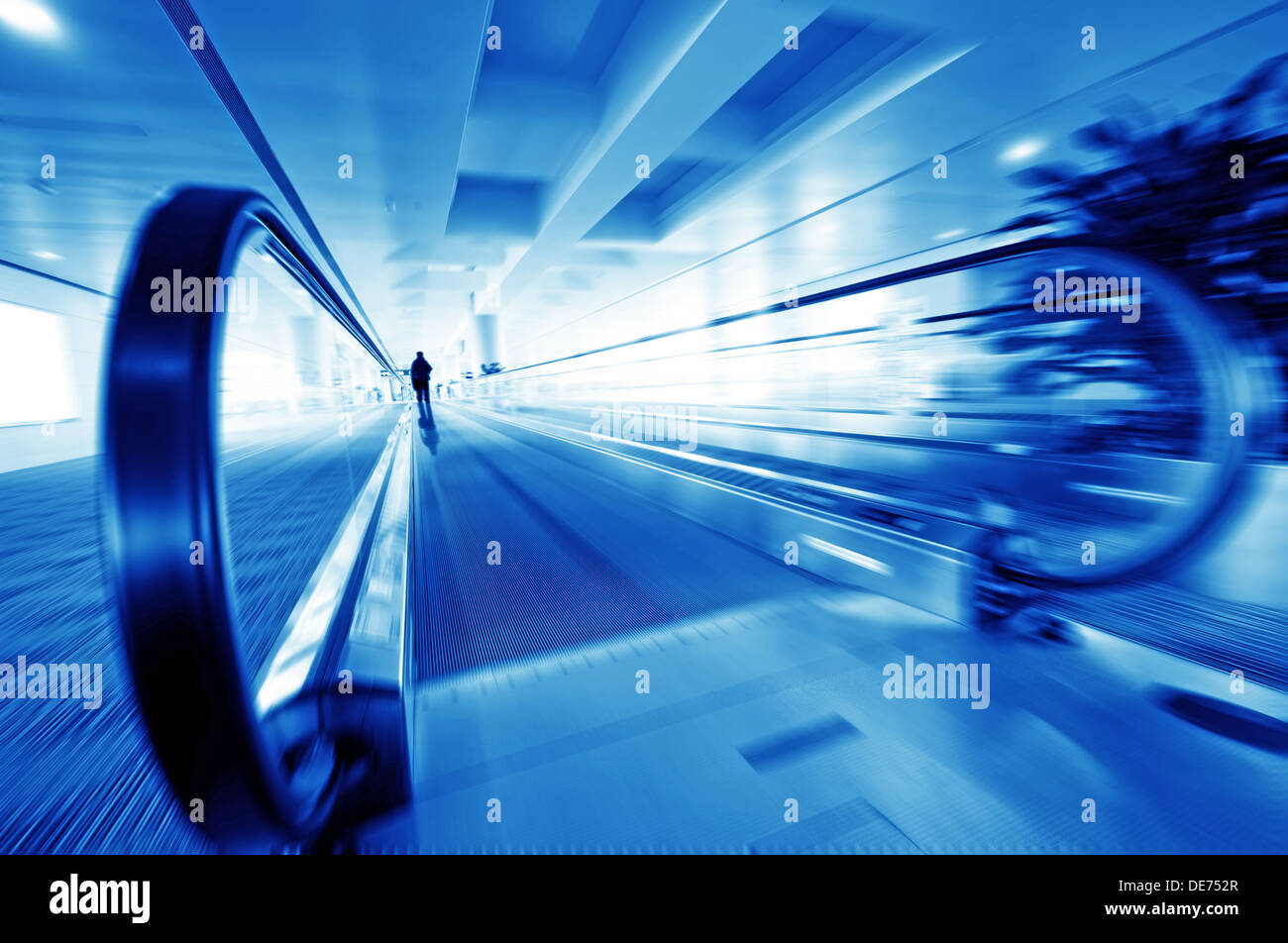 passenger rushing through an escalator in airport terminal Stock Photo ...