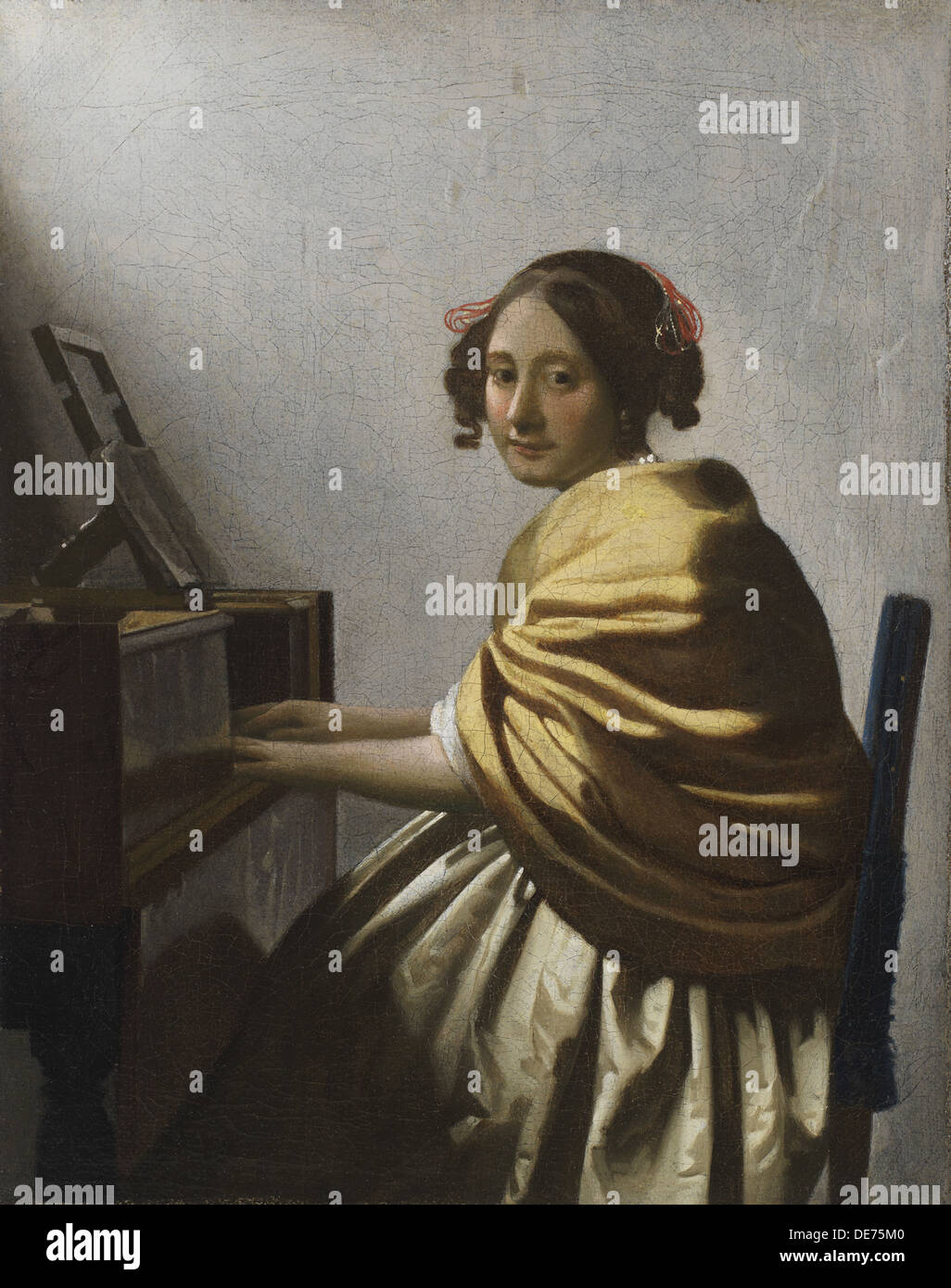 Young woman seated at a virginal hi-res stock photography and images ...