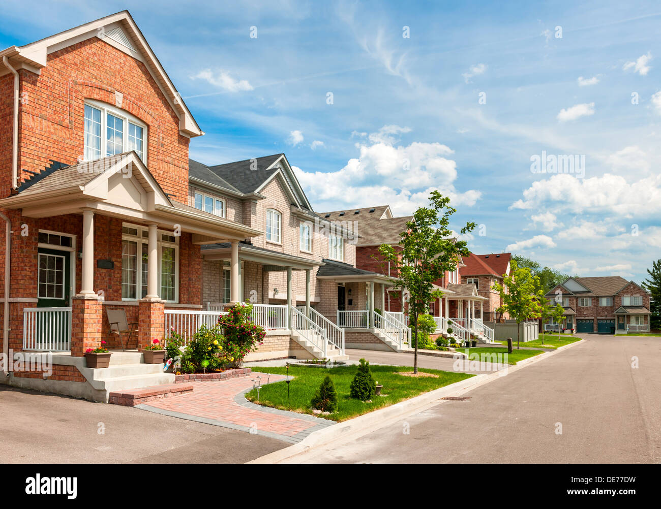 Suburban residential street with red brick houses Stock Photo - Alamy