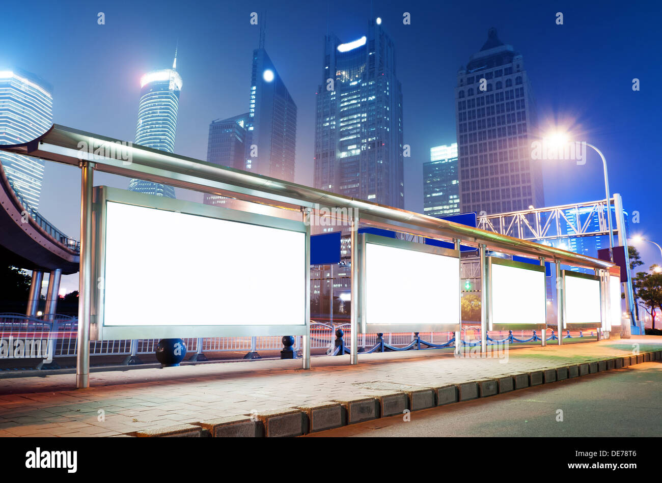 Blank billboard on bus stop at night Stock Photo - Alamy