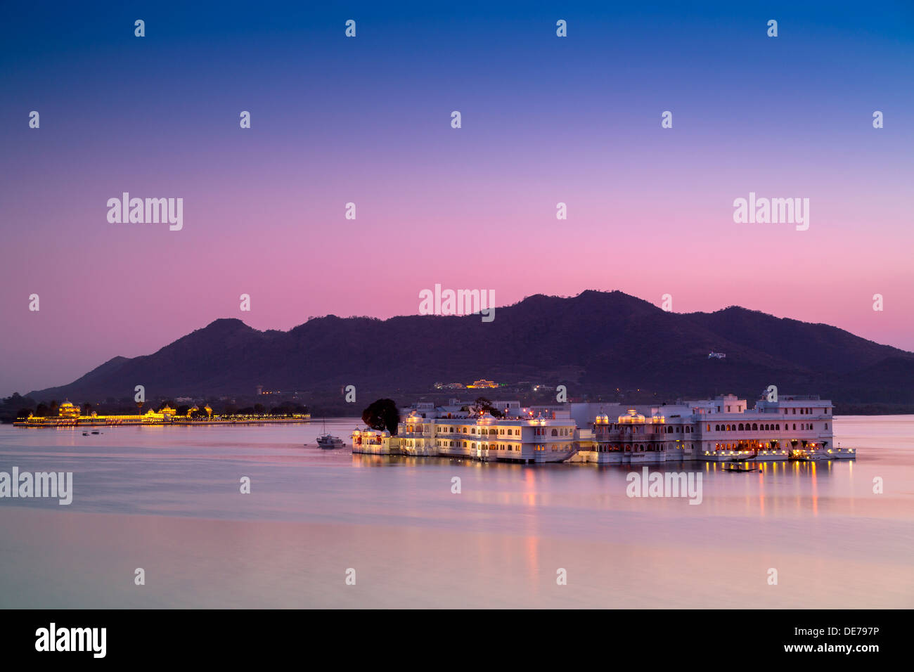 India, Rajasthan, Udaipur, Lake Palace Hotel at twilight Stock Photo ...