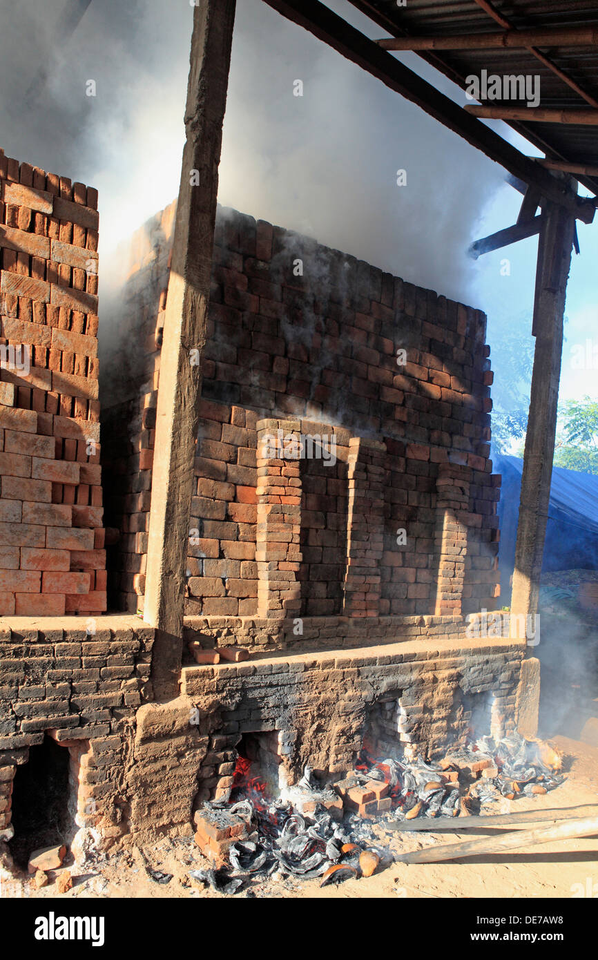 Firing handmade clay bricks at a factory. Anturan Village, Tukaddmunga ...