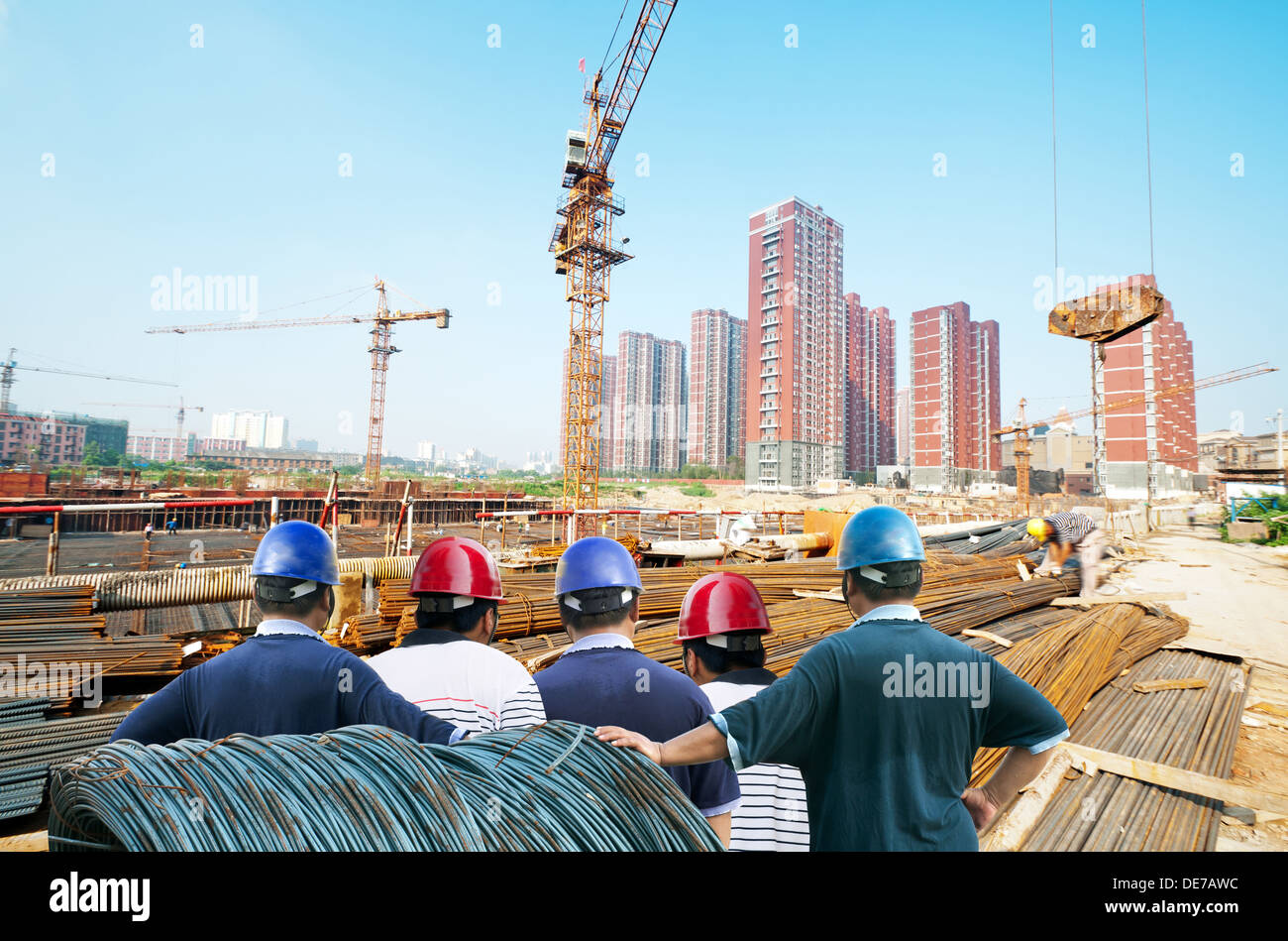 building under construction with workers Stock Photo - Alamy