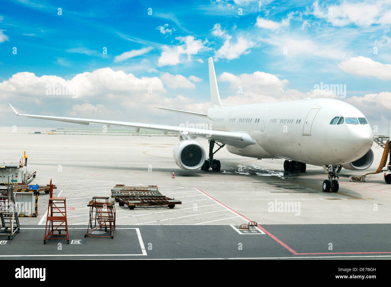 The plane at the airport on loading Stock Photo - Alamy