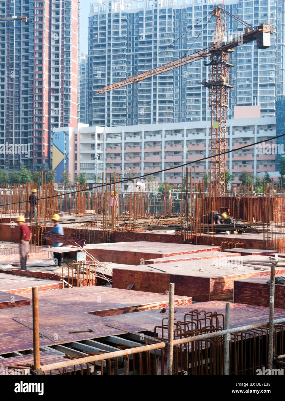 building under construction with workers Stock Photo - Alamy