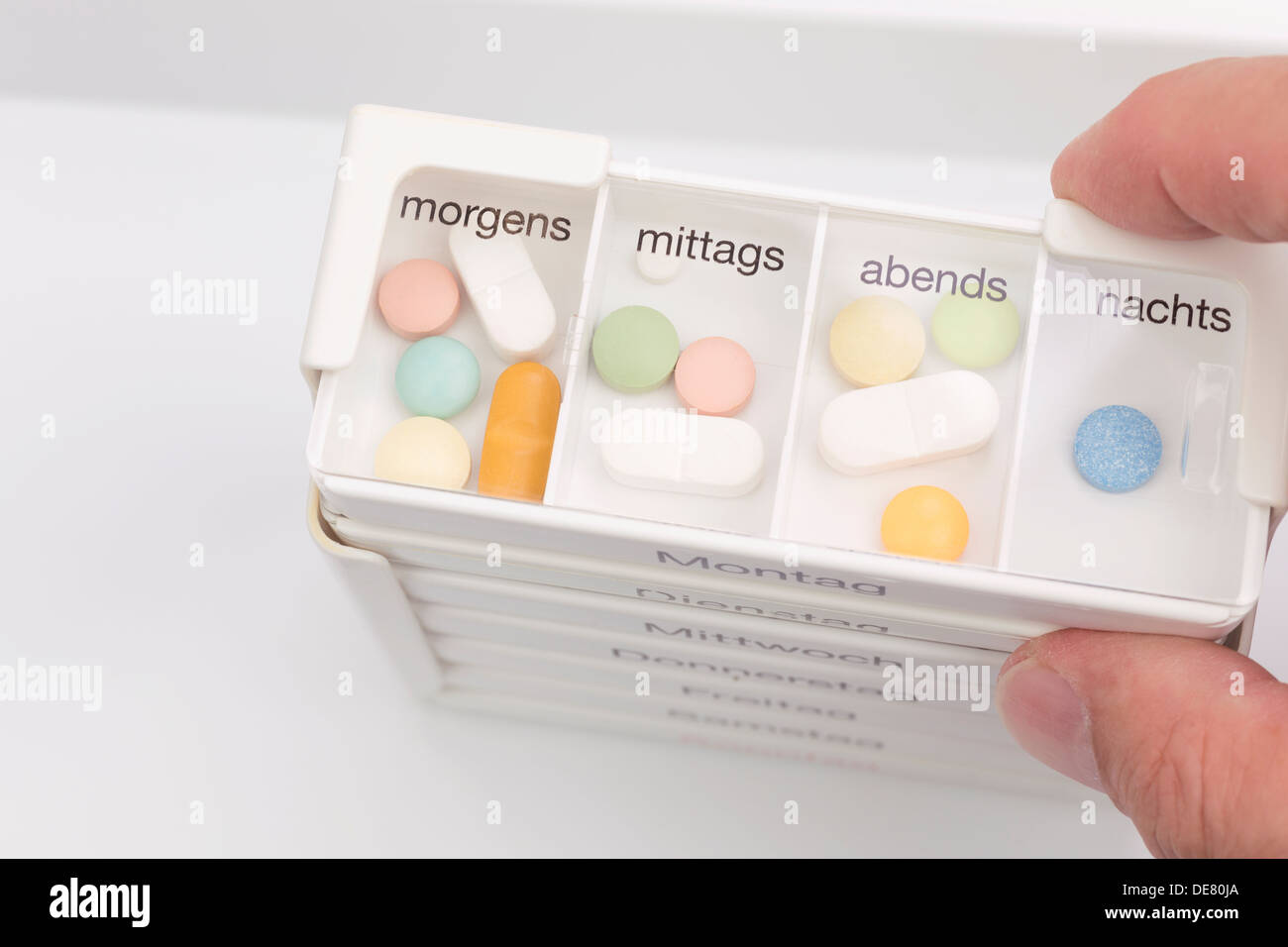 Human hand holding various pill box hi-res stock photography and images ...