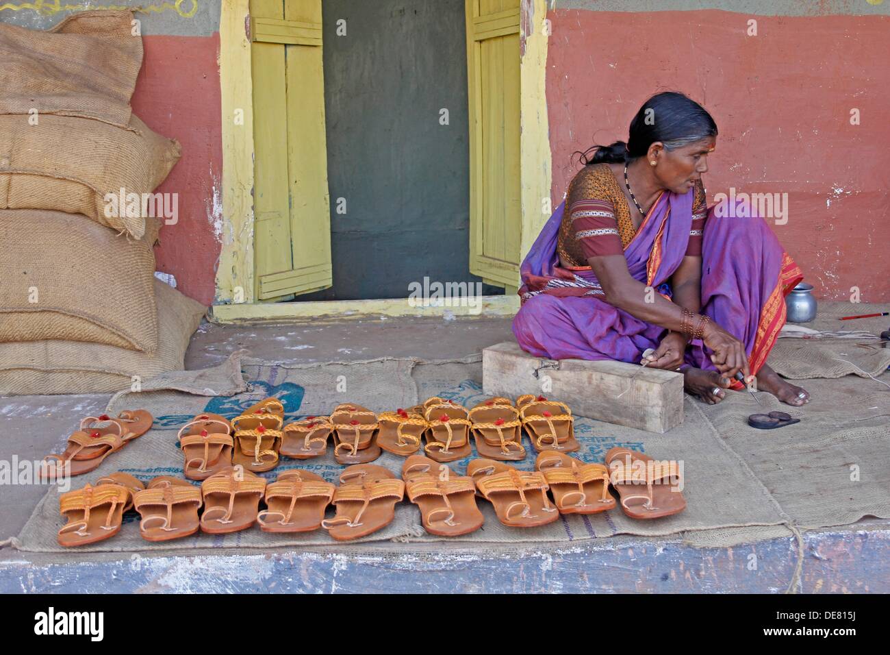 Indian woman making traditional shoes hi-res stock photography and ...