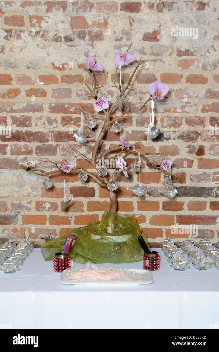 Decorative tree at wedding reception with silver doves and purple ...