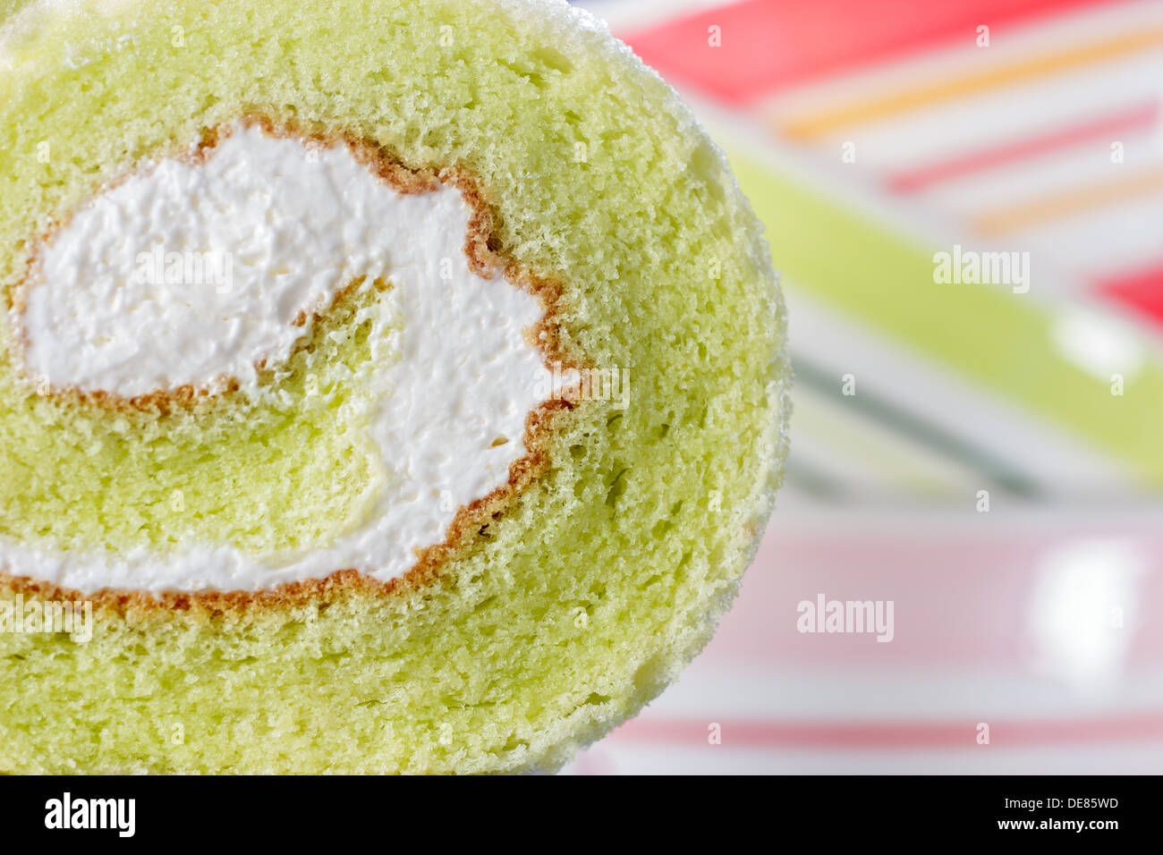 colorful jam roll with vivid background.swiss roll Stock Photo - Alamy