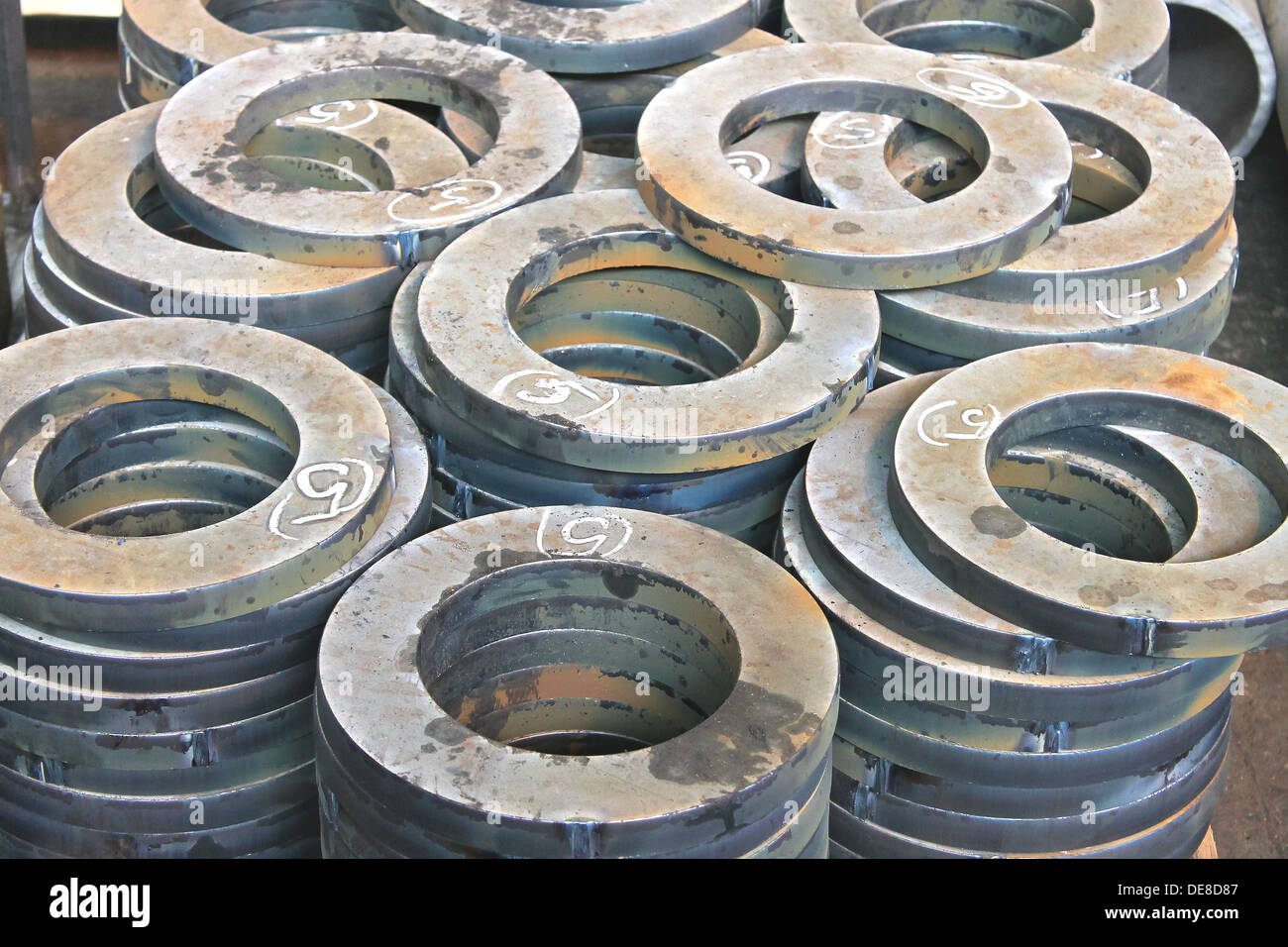 New flanges in the workshop of the plant Stock Photo - Alamy