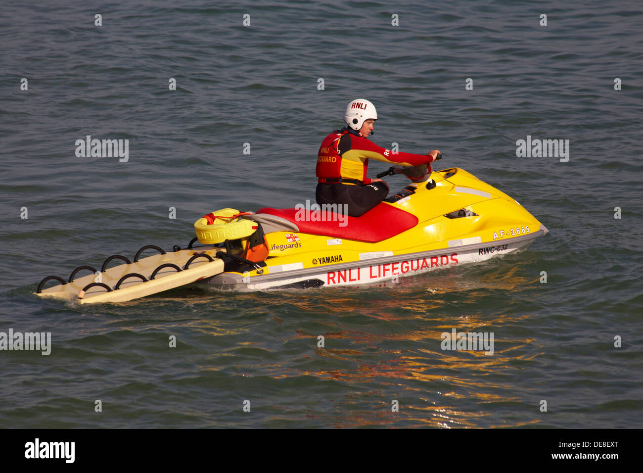 RNLI Lifeguards jetski with lifeguard in sea at Bournemouth, Dorset UK ...