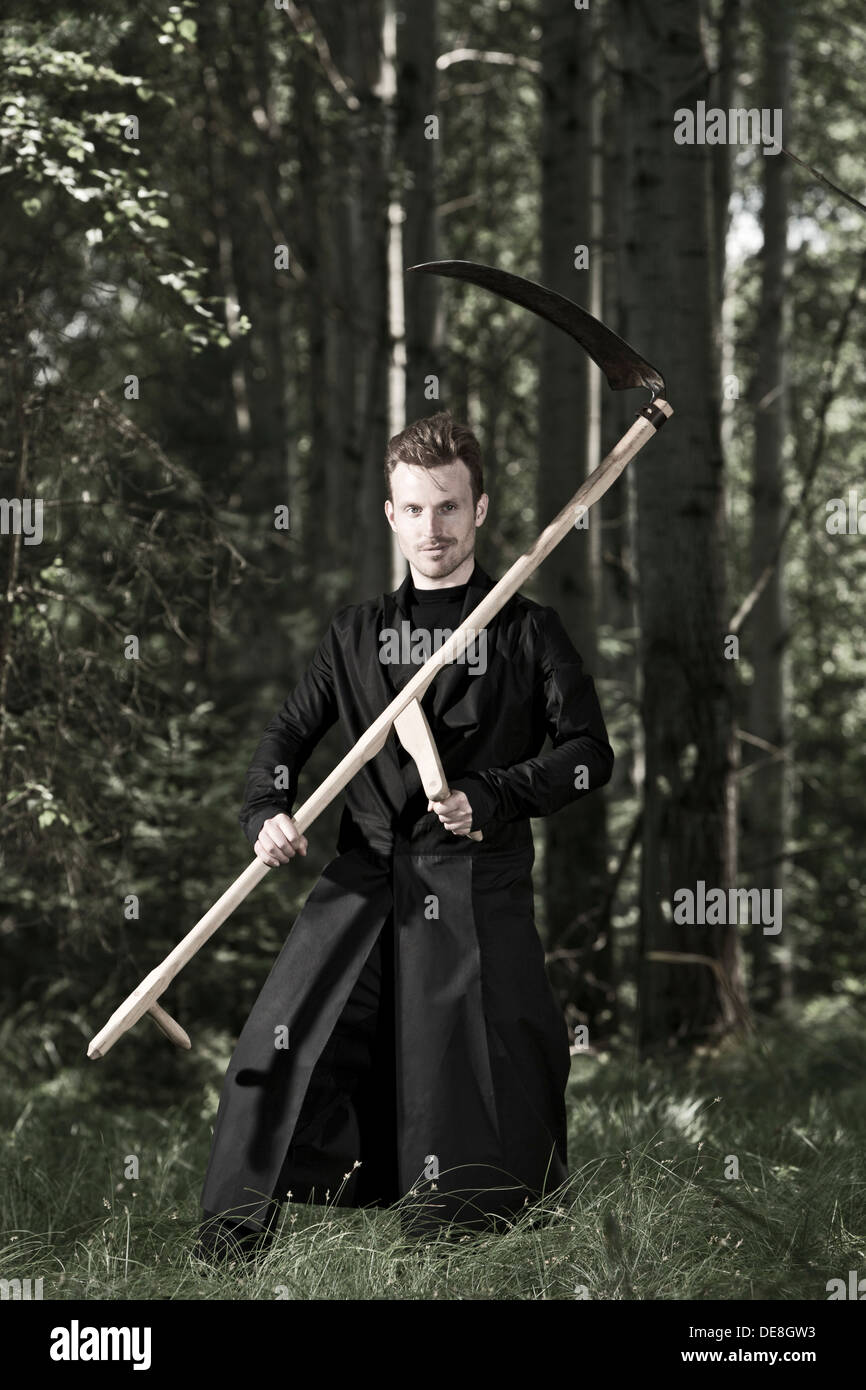 Man with scythe hi-res stock photography and images - Alamy
