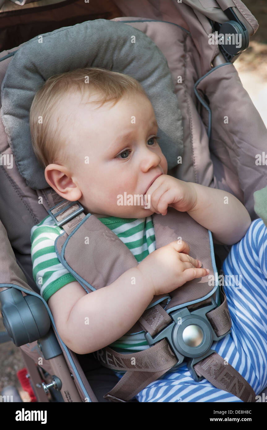 Germany, Hesse, Frankfurt, Baby boy sitting on pushchair Stock Photo ...