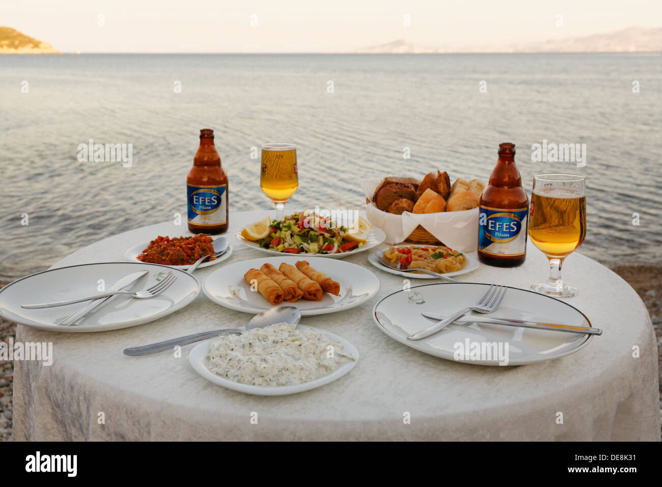 Mixed appetizers with efes beer on table hi-res stock photography and ...