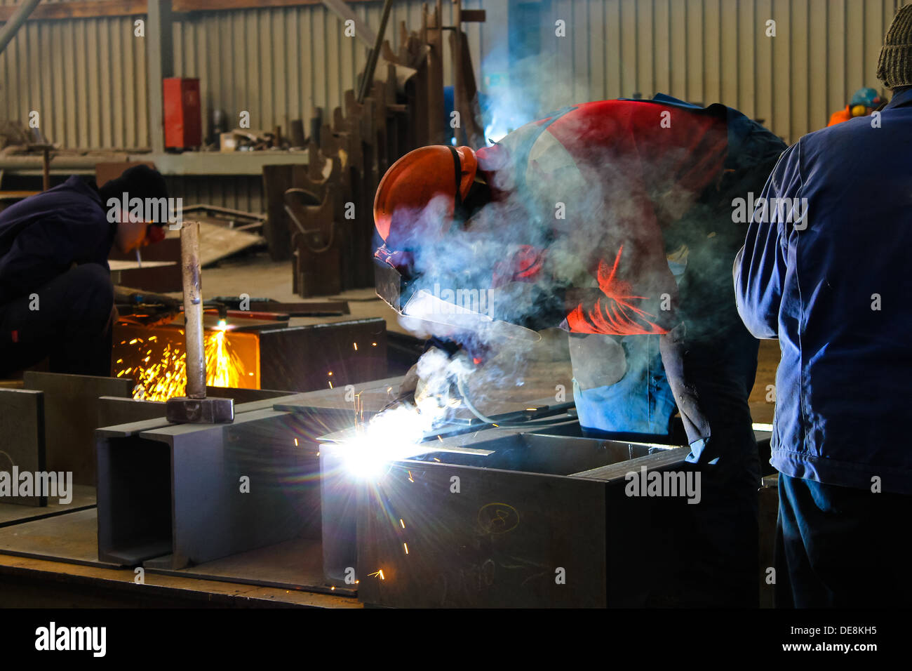 Welders work in the factory floor Stock Photo - Alamy