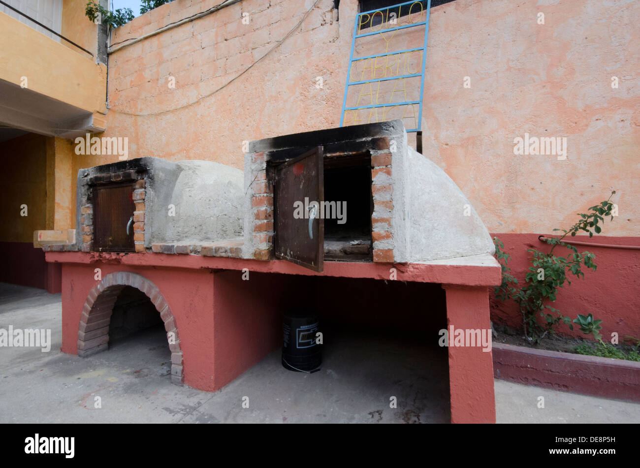 A traditional brick oven used to roast speciality chicken dish at a ...