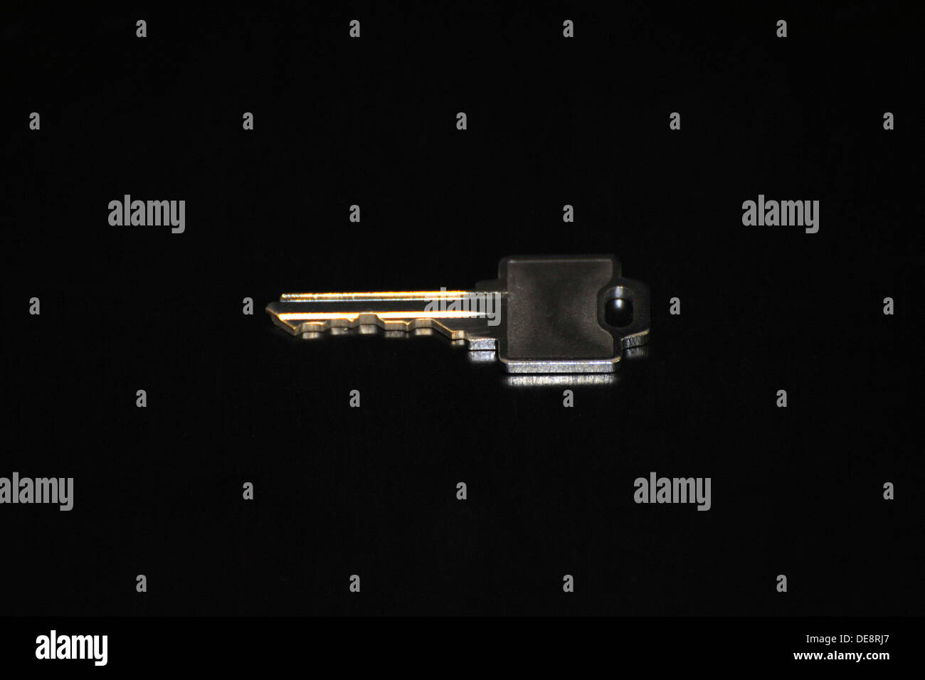 A metal house key Stock Photo - Alamy