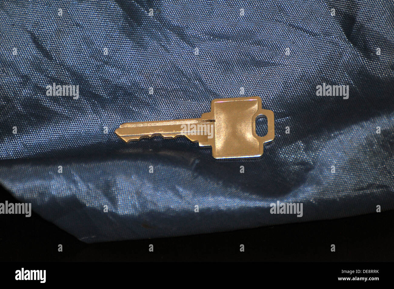 A metal house key Stock Photo - Alamy