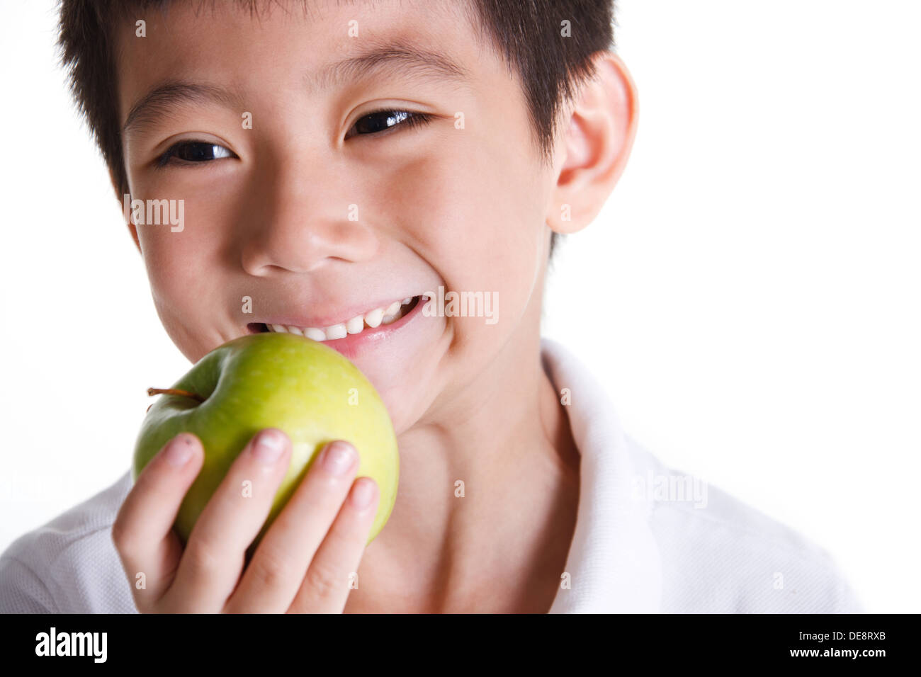 Beautiful boy eating apple hi-res stock photography and images - Alamy