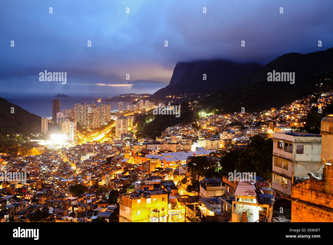 Night view from top of Favela da Rocinha, upper class Sao Conrado ...