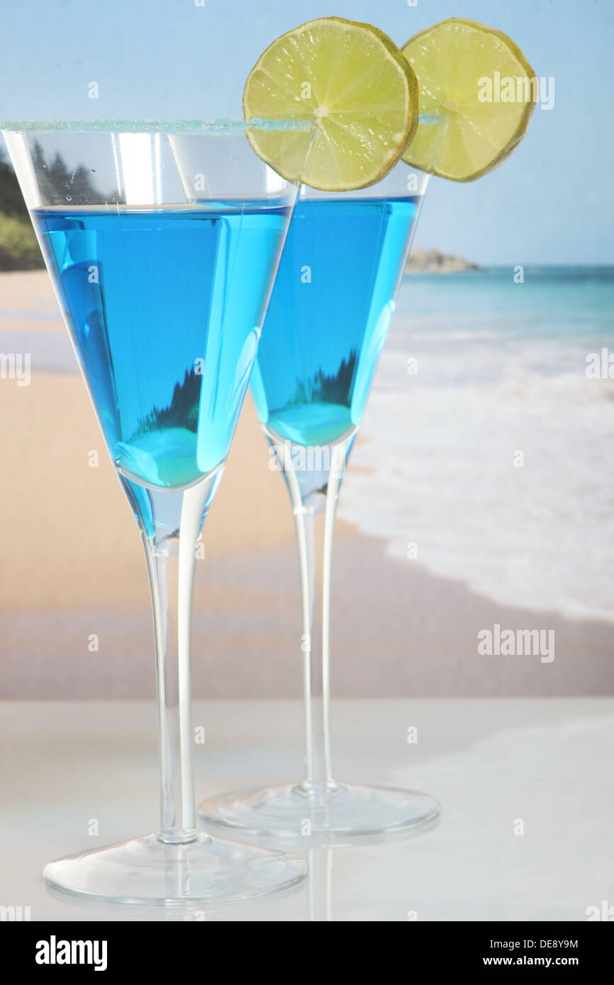 Two blue cocktails on beach Stock Photo - Alamy