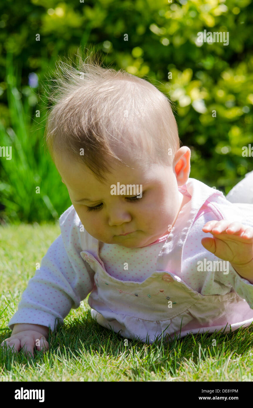 Baby outside on grass hi-res stock photography and images - Alamy