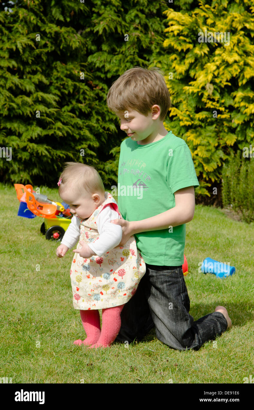Sister holding baby hi-res stock photography and images - Alamy