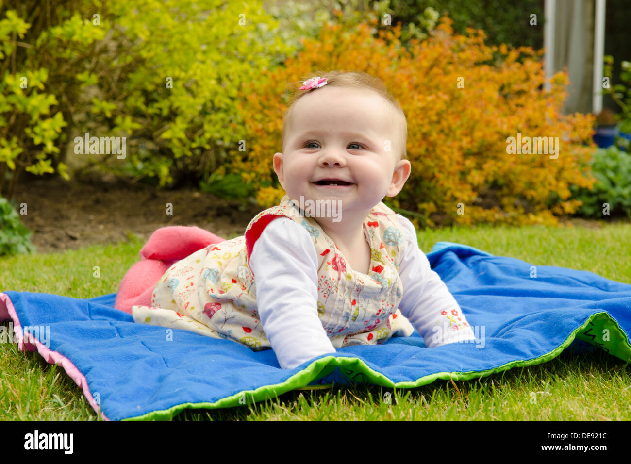Baby outside on grass hi-res stock photography and images - Alamy