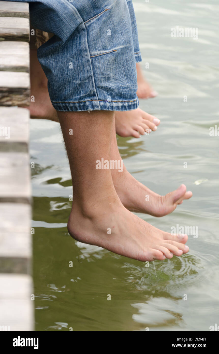 Soaking the feet of the pier Stock Photo - Alamy
