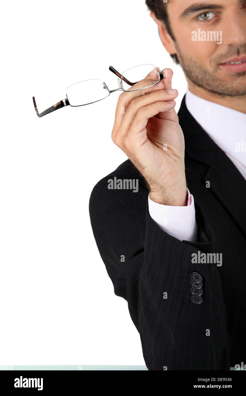 Man taking off his glasses Stock Photo - Alamy