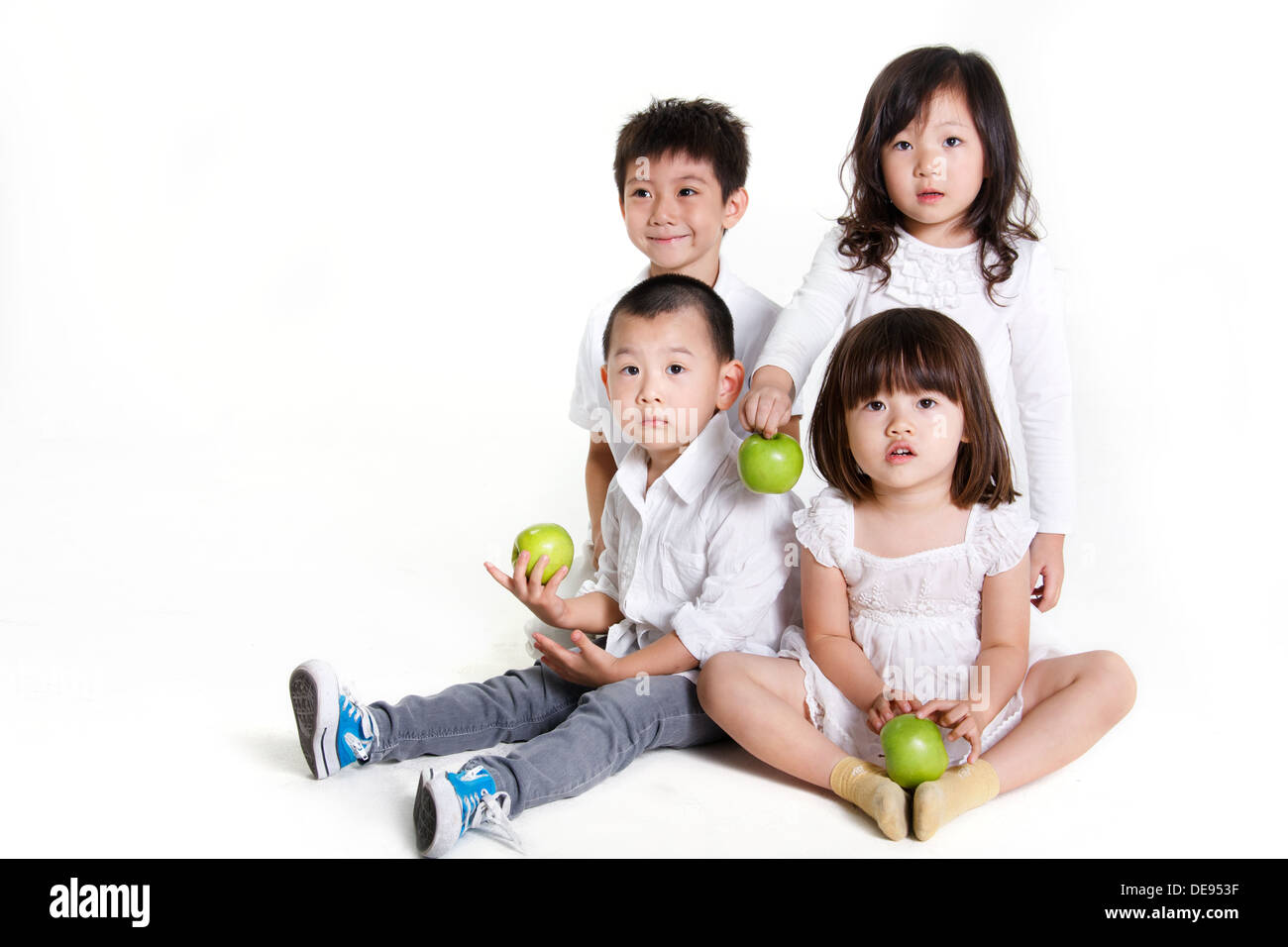 Children sitting together Stock Photo - Alamy